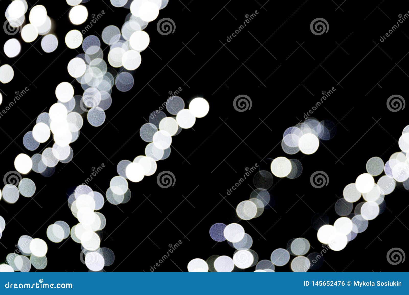 Unfocused Abstract White Bokeh on Black Background. Defocused and ...