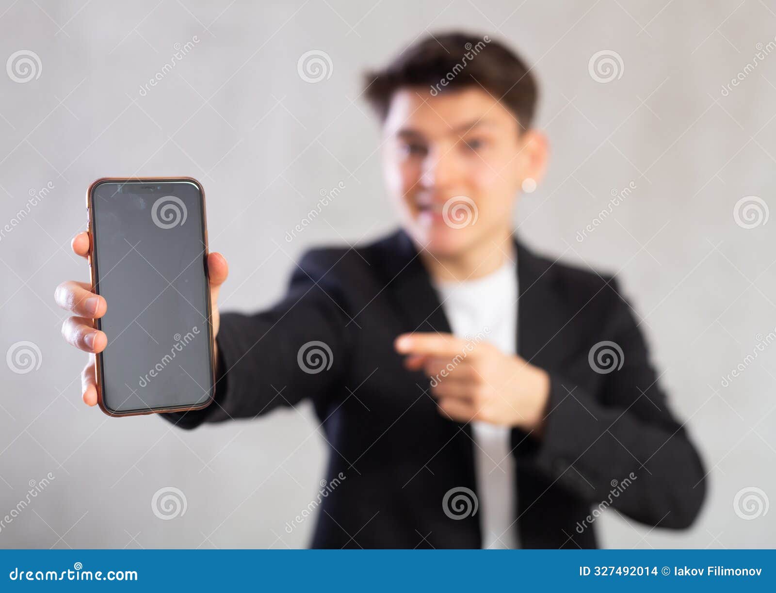 Unfocused Agent in Suit Jacket Shows Dark Empty Mobile Phone Screen and ...