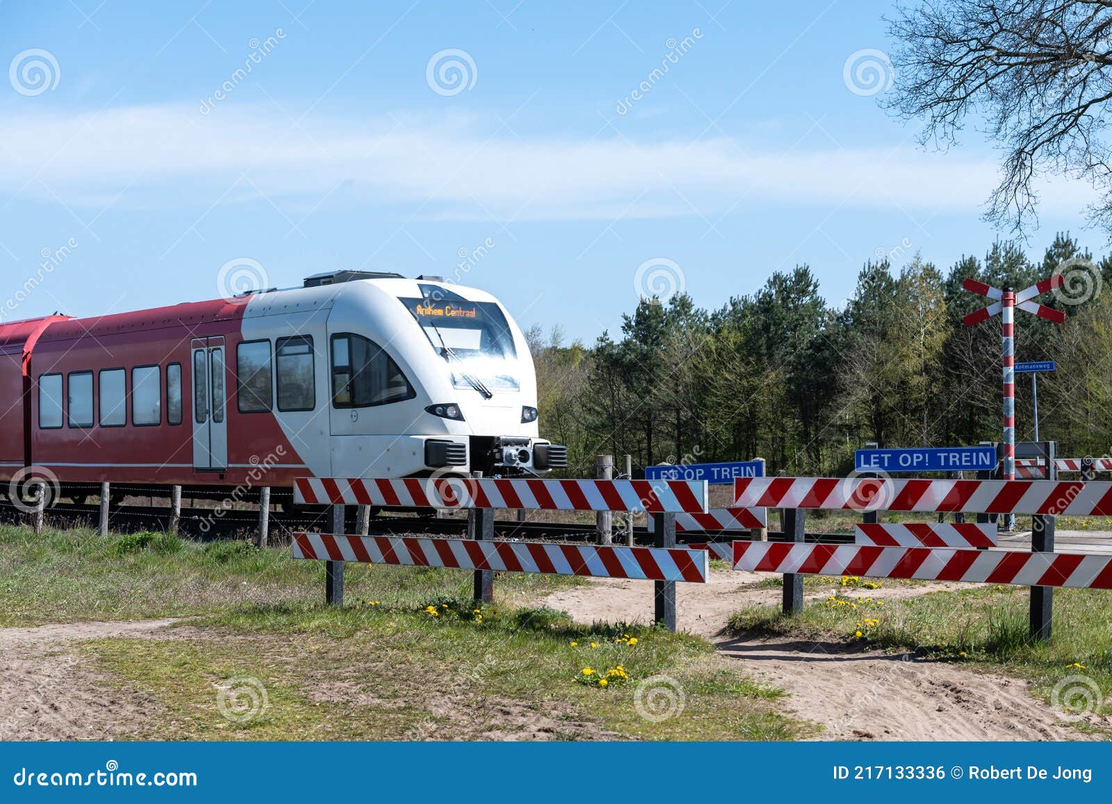 Unguarded Level Crossing with Passing Train Stock Photo - Image of ...