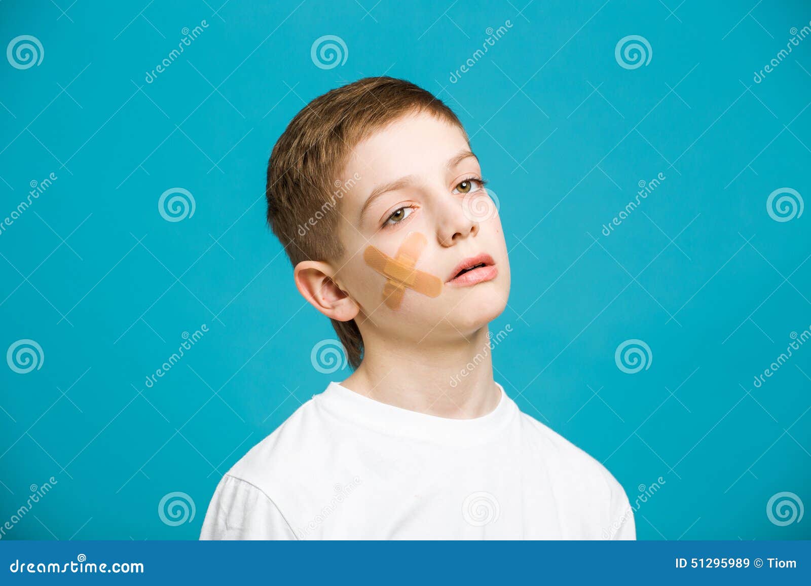 Unhappy Boy with Adhesive Plaster on His Cheek Stock Image - Image of ...