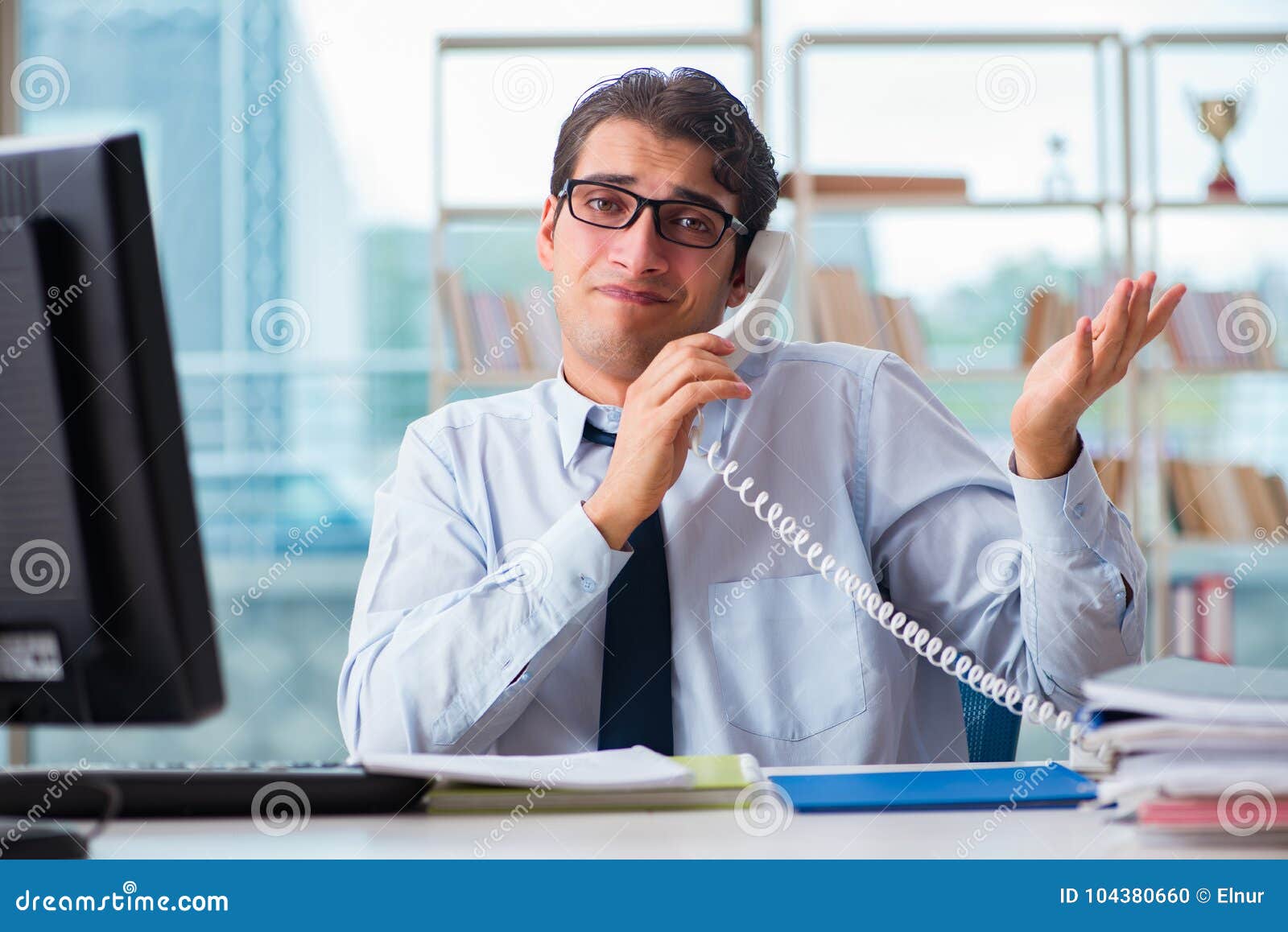 The Unhappy Call Center Employee Taking Another Call Stock Photo ...