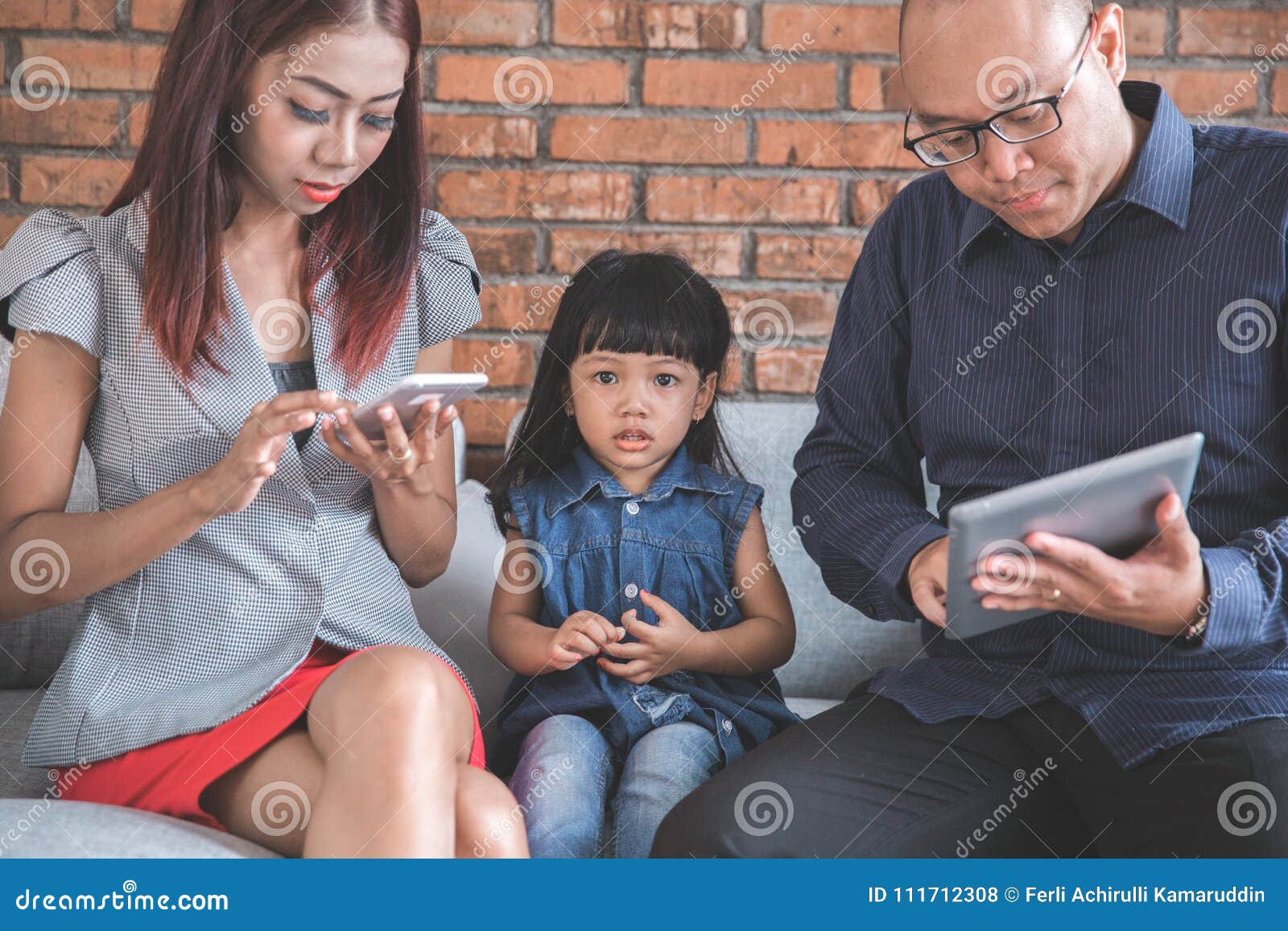 Busy Parenting Using Gadget Stock Photo - Image of beautiful, handphone ...