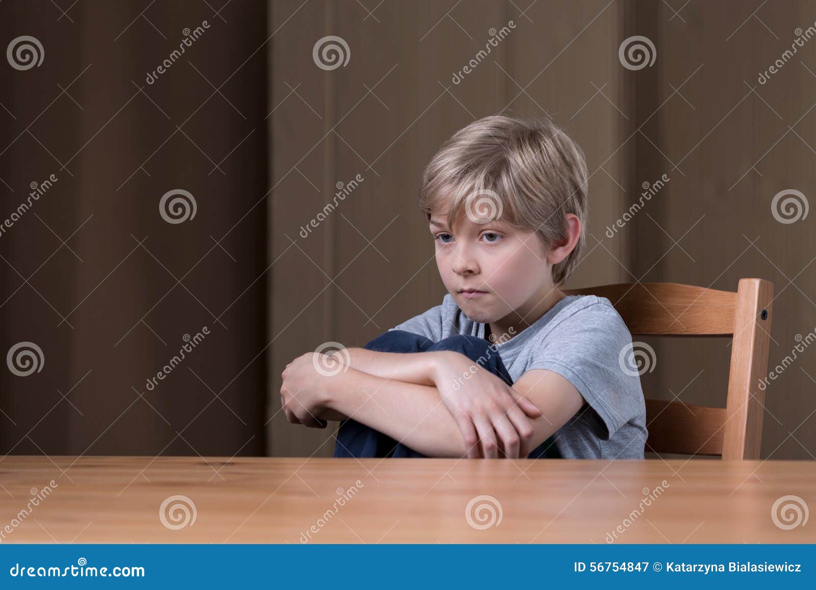 Unhappy Kid Sitting on Chair Stock Image - Image of blonde, legs: 56754847