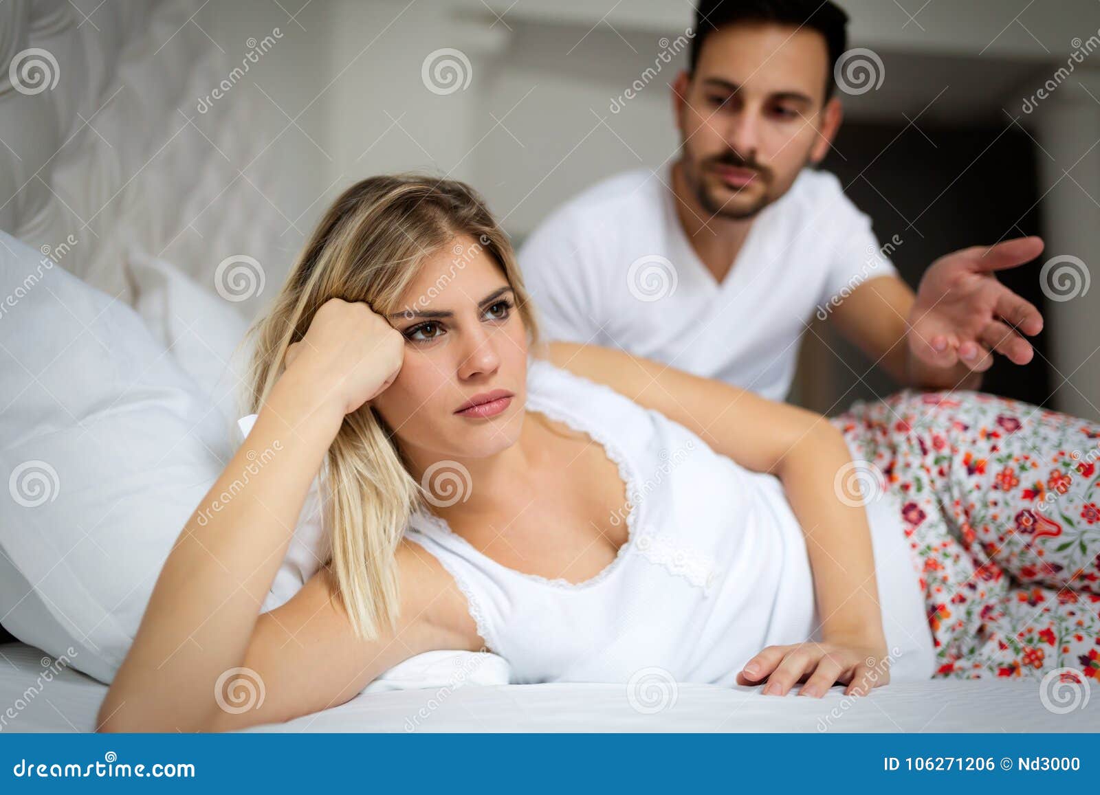 Relationship Problems, Conflict. A Married Couple Sits On The Couch ...