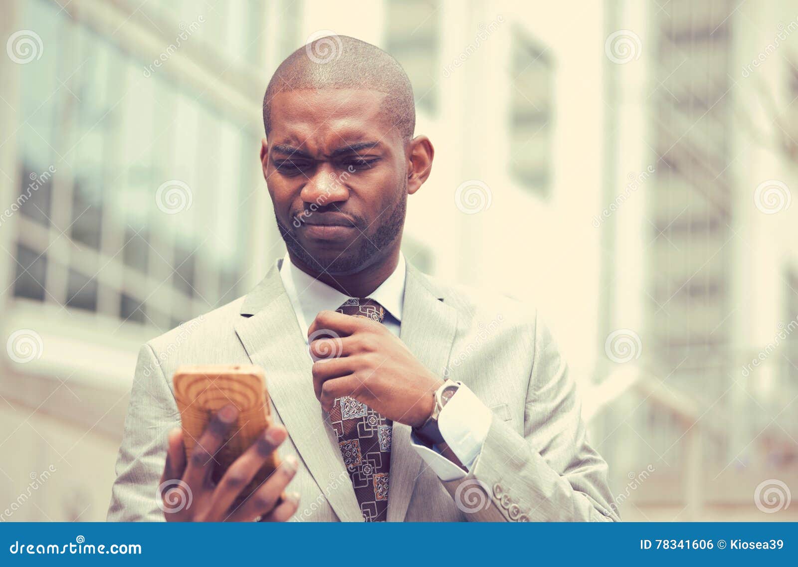 Unhappy Young Man Talking Texting on Cellphone Outdoors Stock Photo ...