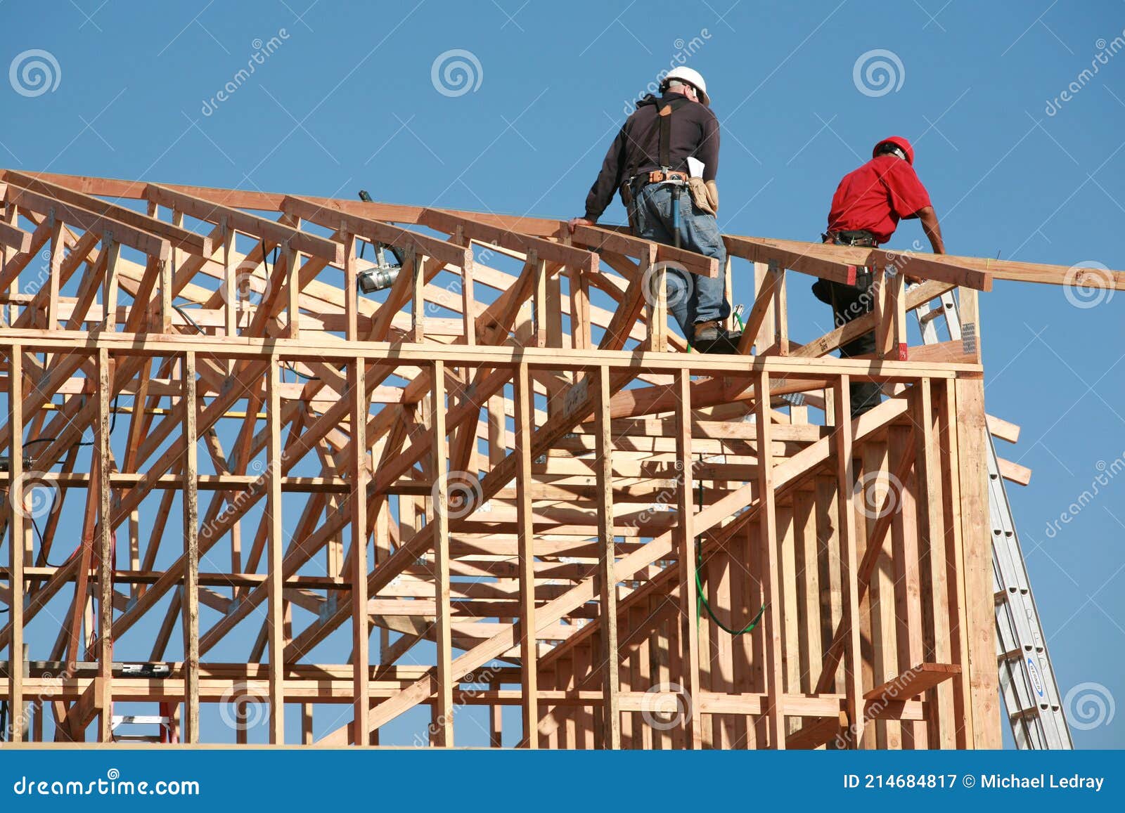 Unidentifiable Construction Workers Work on Framing a Building ...