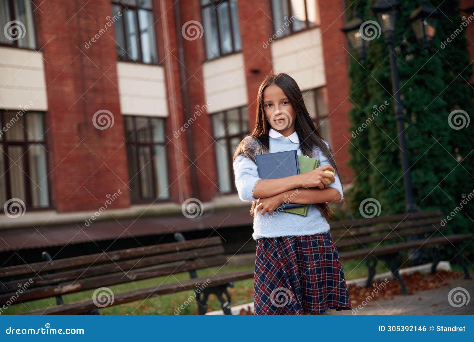 In Uniform, Against Building. School Girl is Outdoors Stock Photo ...