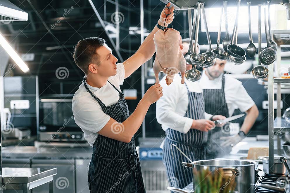 In Uniform. Kitchen Workers is Together Preparing the Food Stock Photo ...
