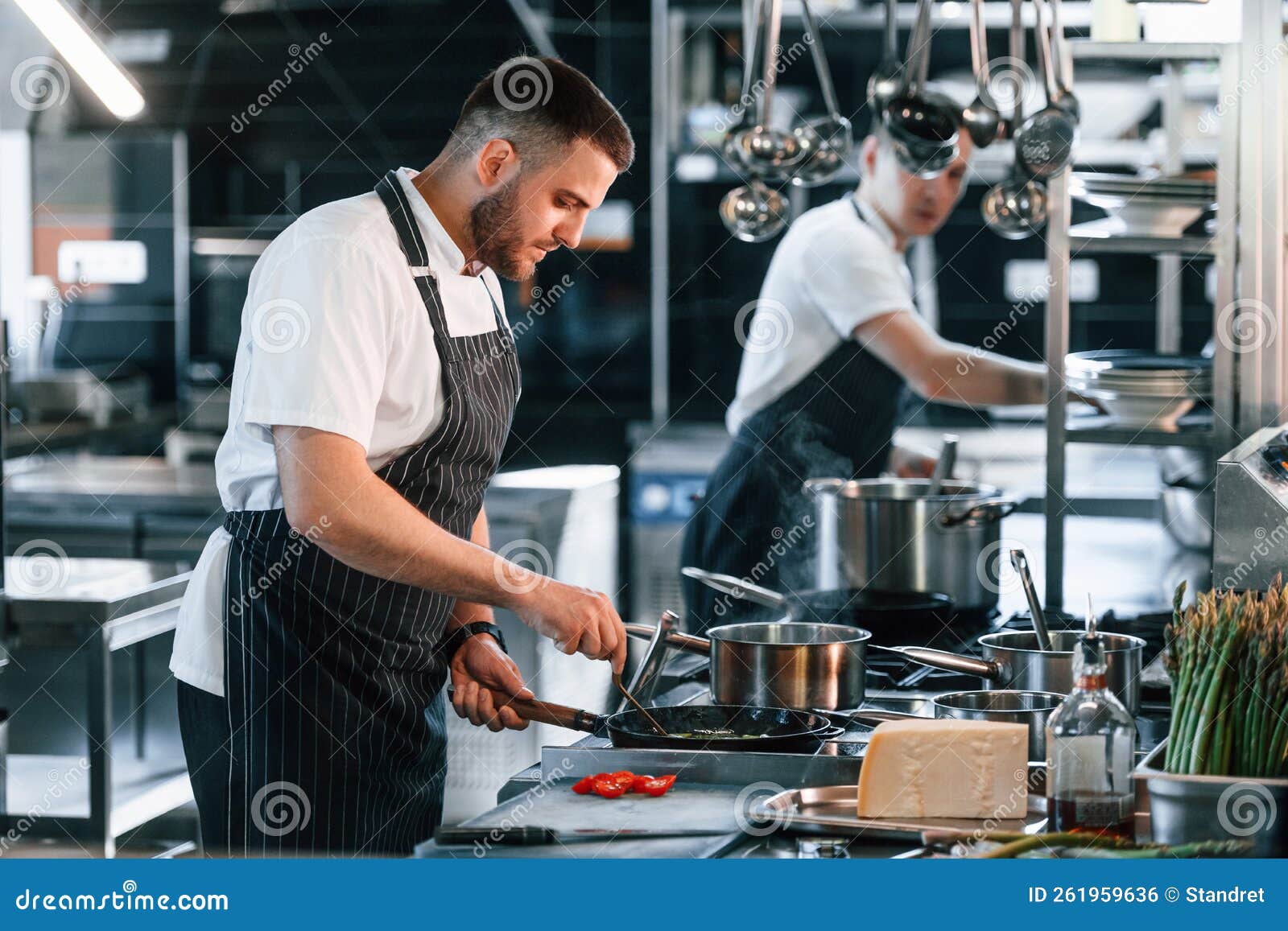 In Uniform. Kitchen Workers is Together Preparing the Food Stock Photo ...