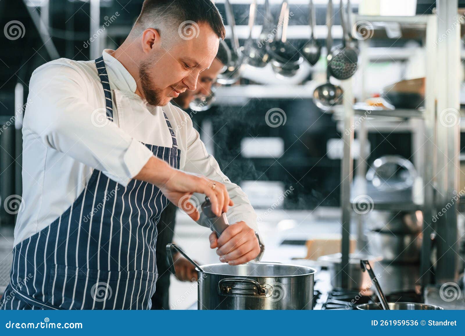 In Uniform. Kitchen Workers is Together Preparing the Food Stock Photo ...