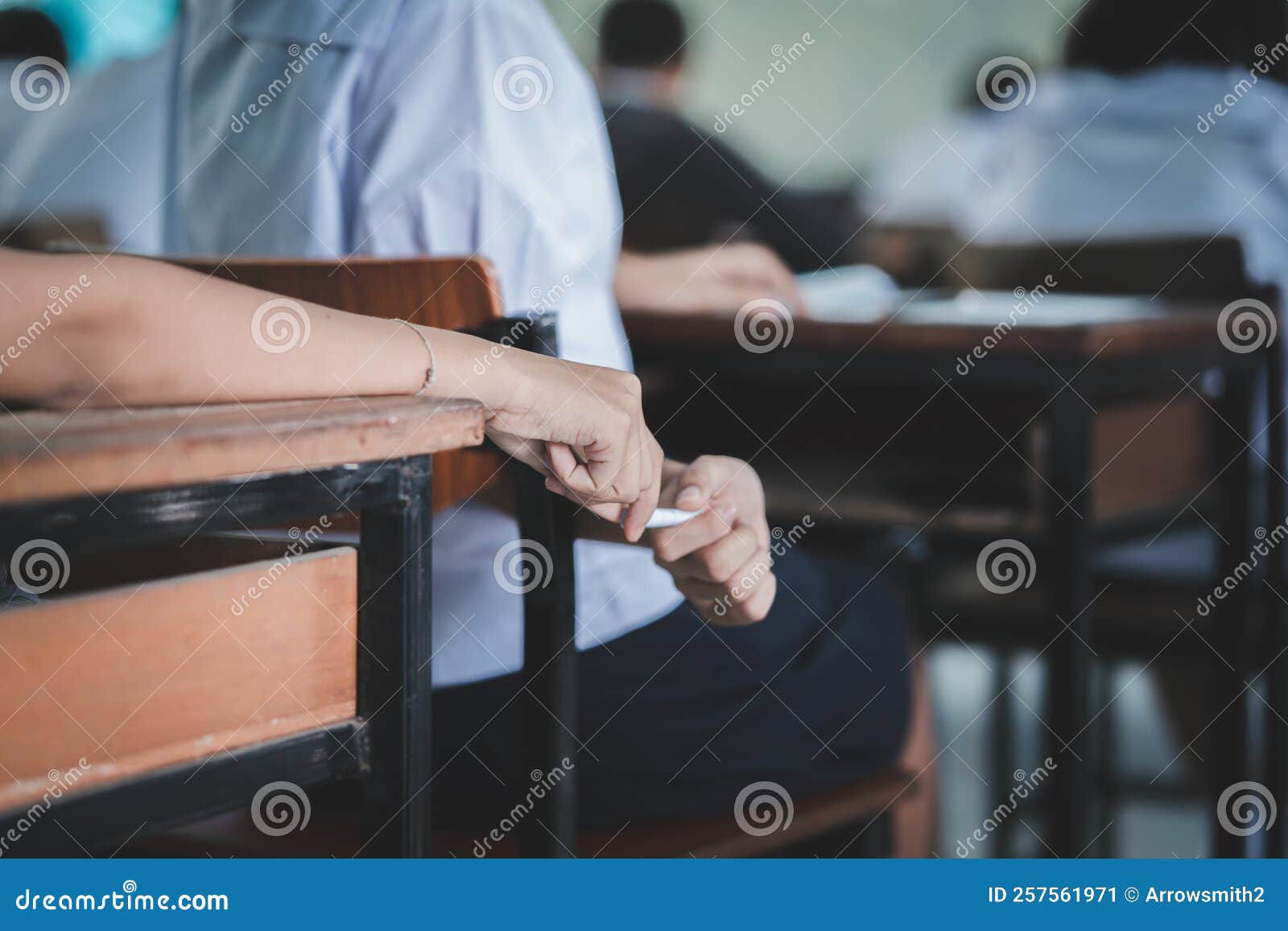Uniform Students Passing Test Note Secretly during Examination. Concept ...