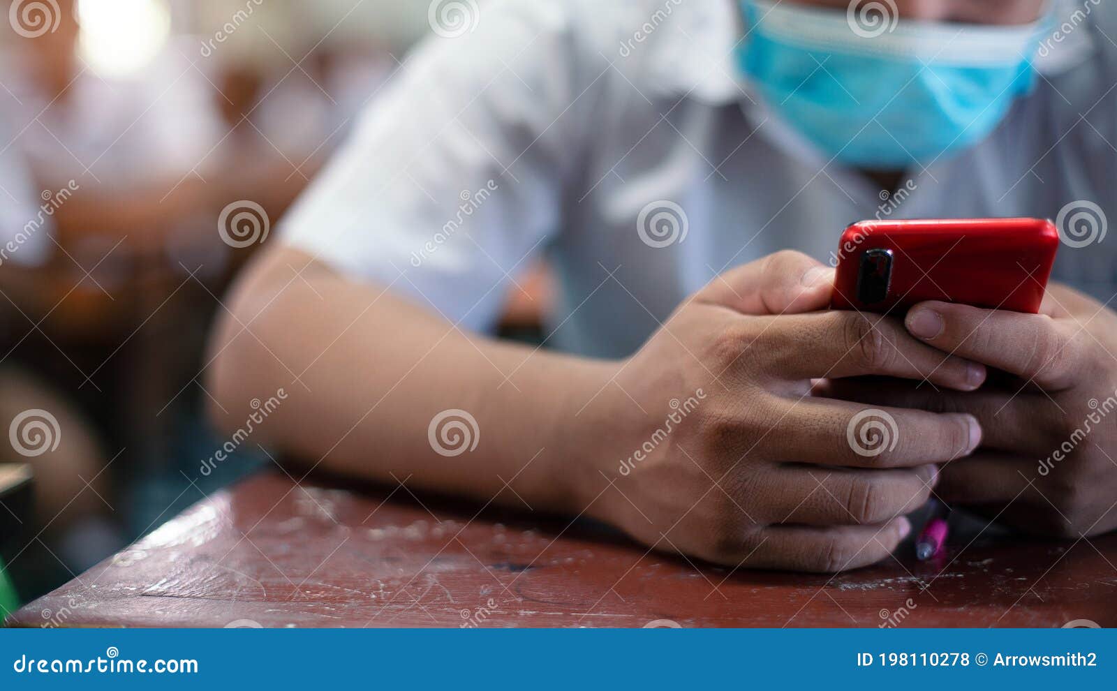 Uniform Students are Study Online or Test Exam by Using Smartphone and ...