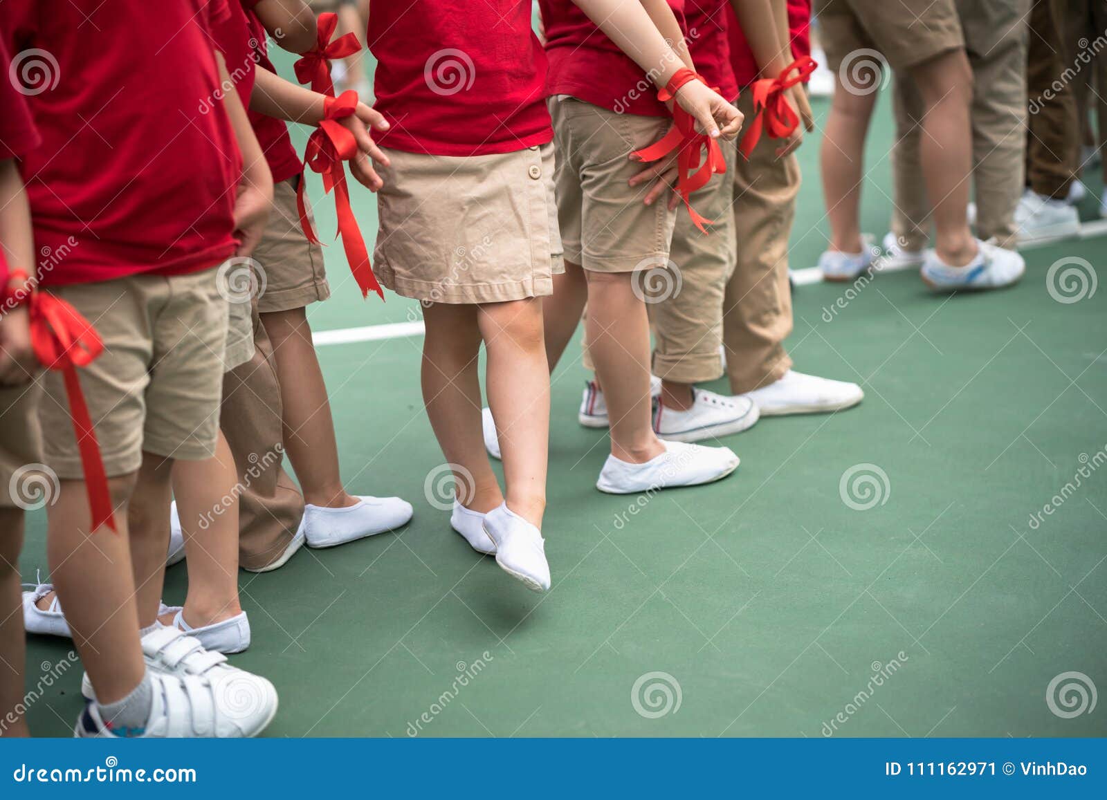 Uniformed Children Aligned Legs Standing on School Playground Stock ...