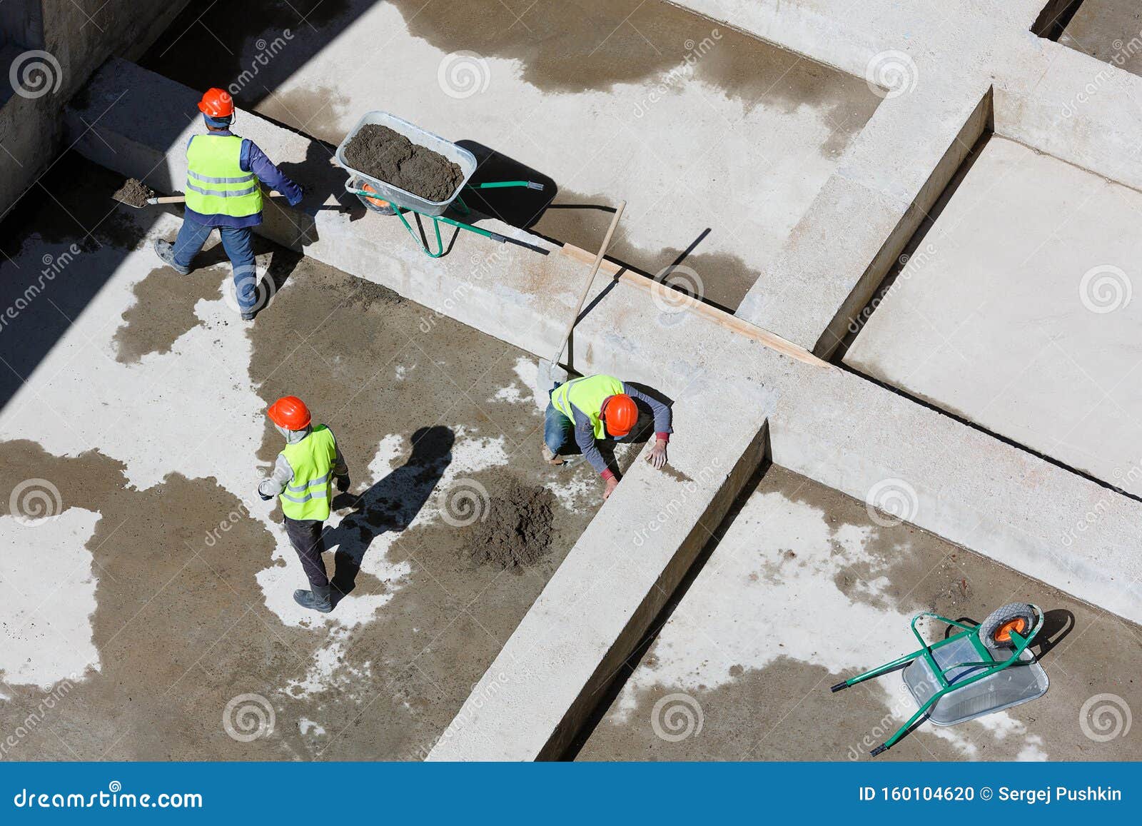Uniformed Workers Clean Sand on a Construction Site, Top View Editorial ...