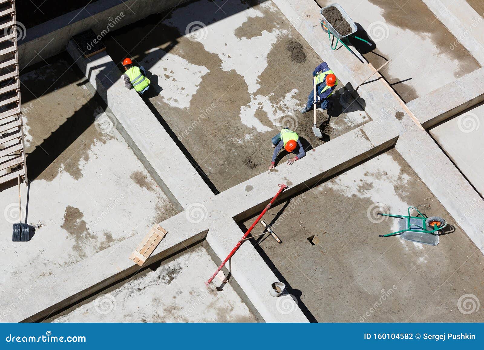 Uniformed Workers Clean Sand on a Construction Site Editorial ...