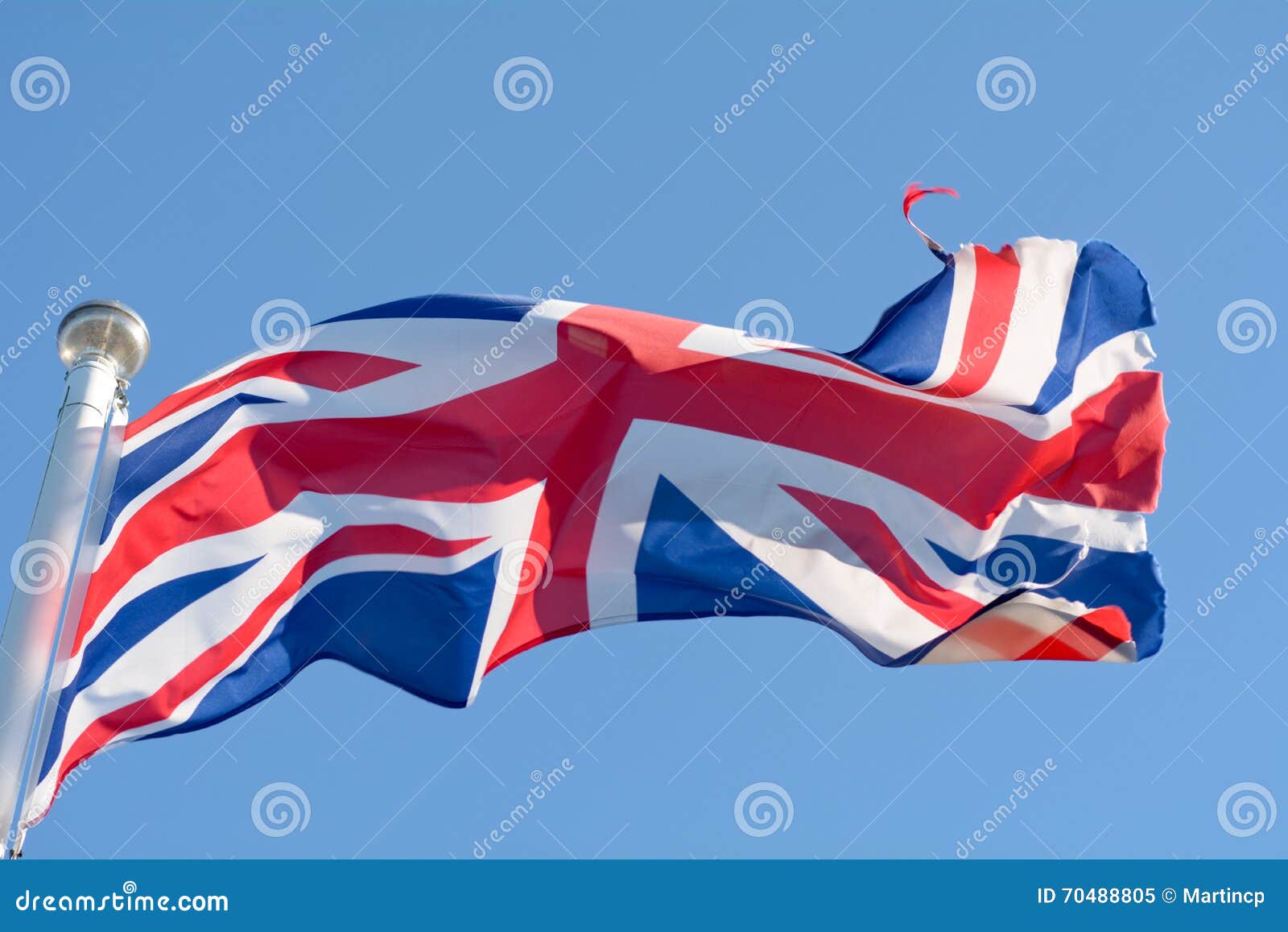 The Union Jack Flag Fluttering Wildly in the Wind on a Sunny Day Stock ...