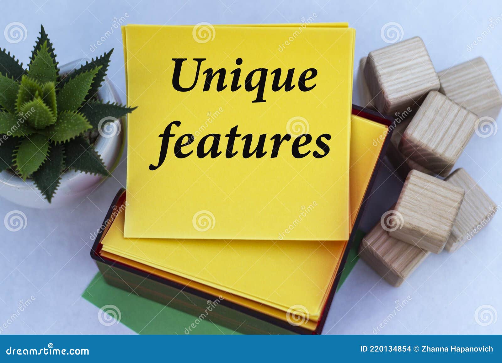 UNIQUE FEATURES - Words on a Yellow Note Paper on a Light Background ...