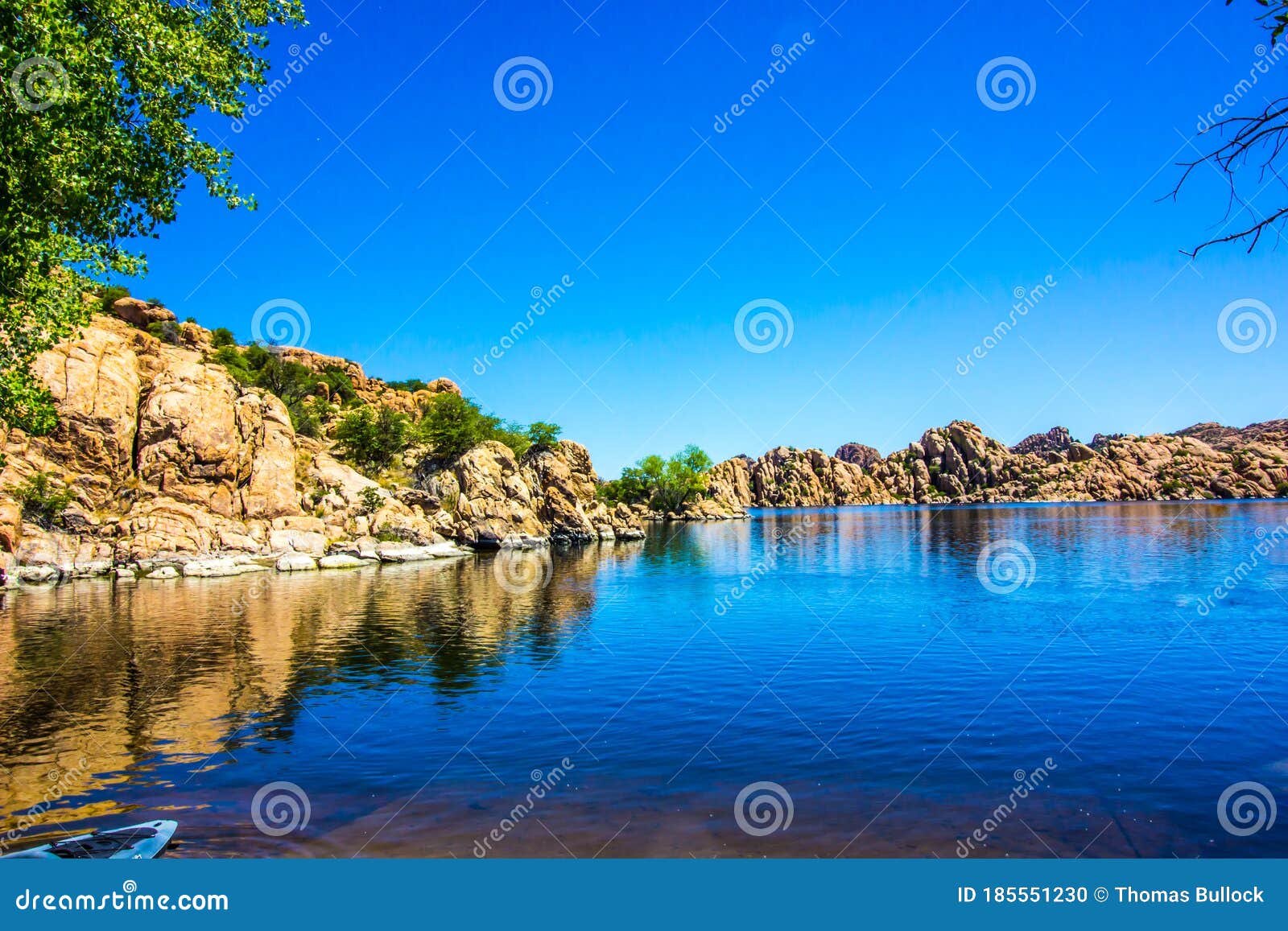 Shimmering Waters Around Rock Shoreline of Lake in Foothills Stock ...