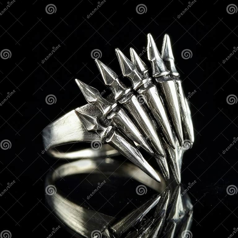 Unique Silver Ring Featuring Intricate Spike Design on a Shiny Band ...