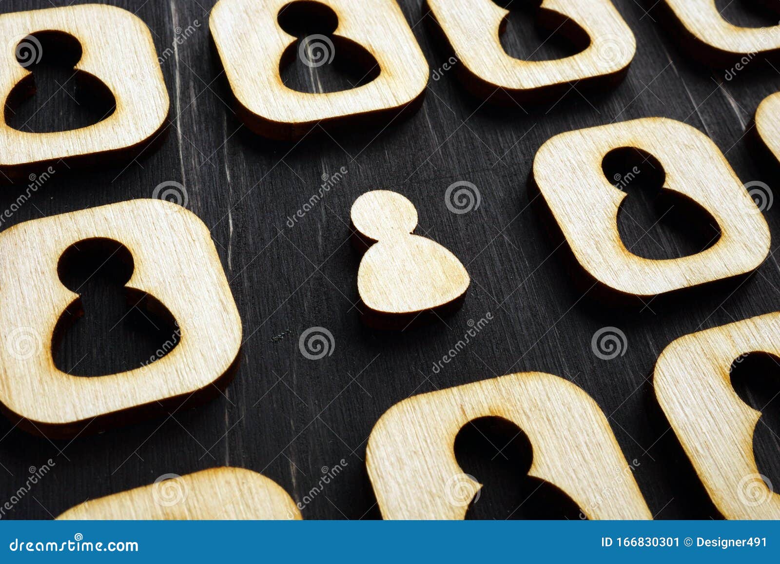 Unique Stand Out of the Crowd. Wooden Figures on the Dark Surface Stock ...