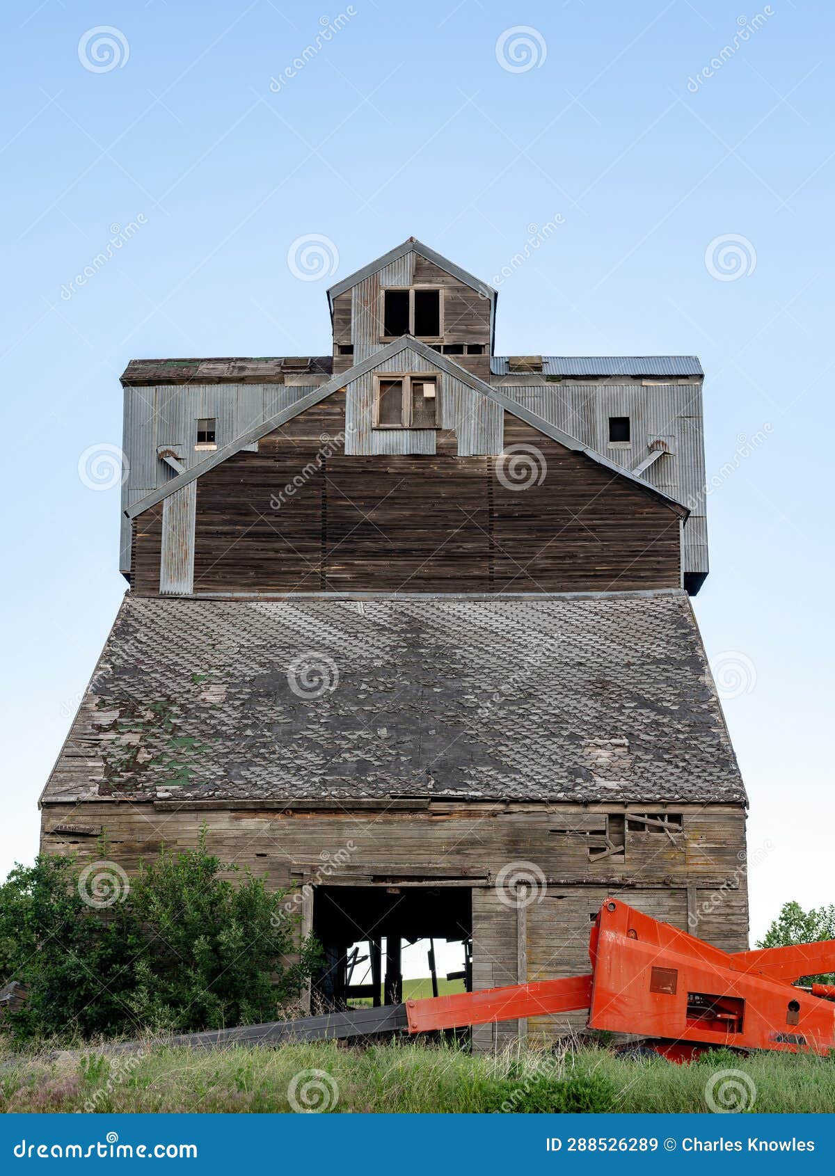 Unique Unusual Barn with Orange Implement in a Field Stock Image ...