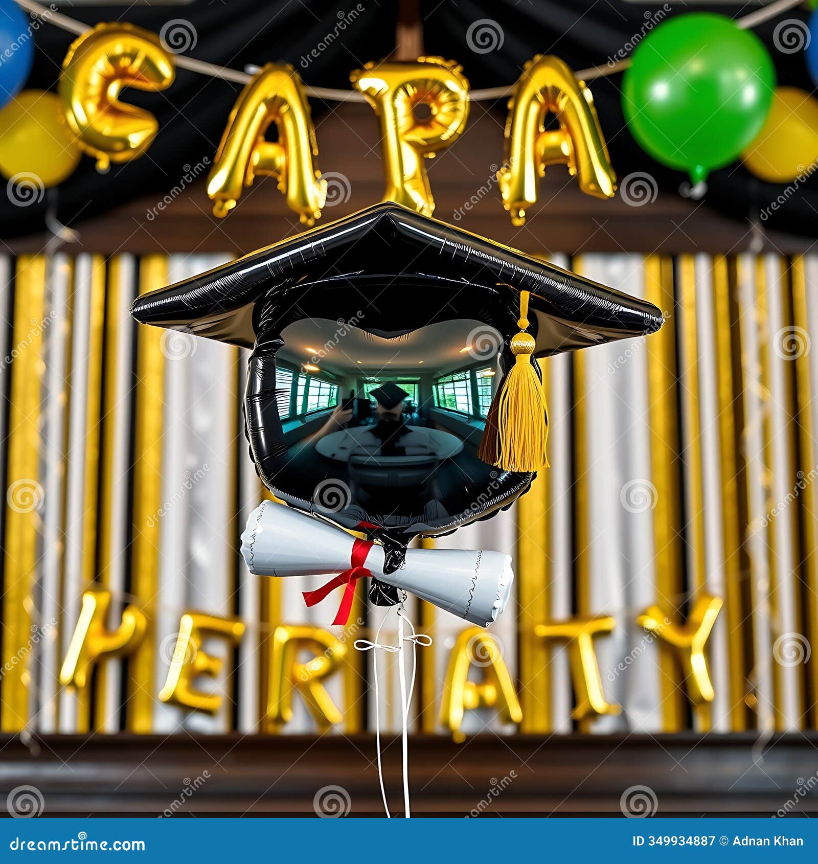 A Graduation Party with a Large Cap Shaped Balloon and Diploma ...