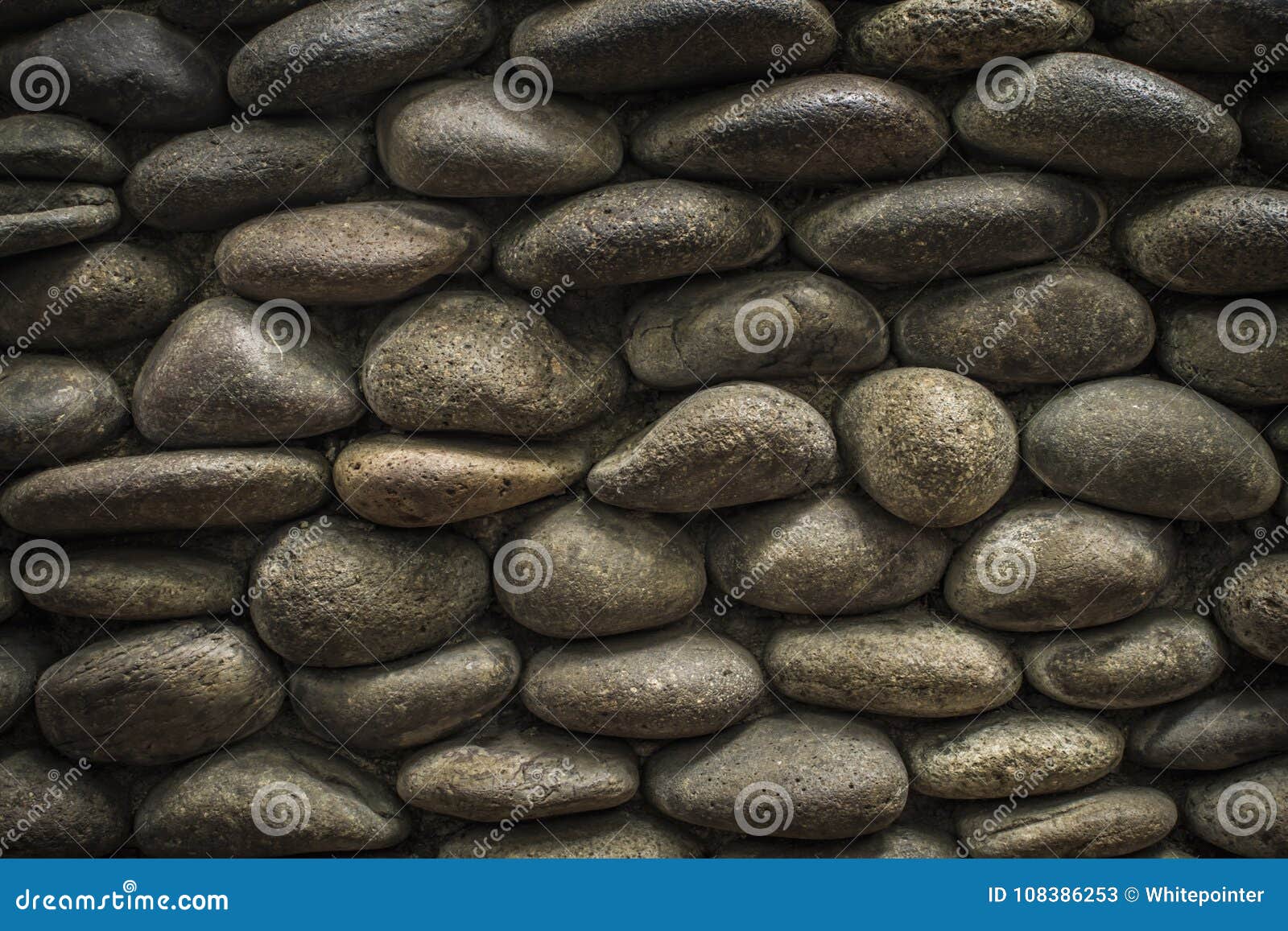 A Unique Wall Texture Using Natural Rounded Stone. Stock Image - Image ...