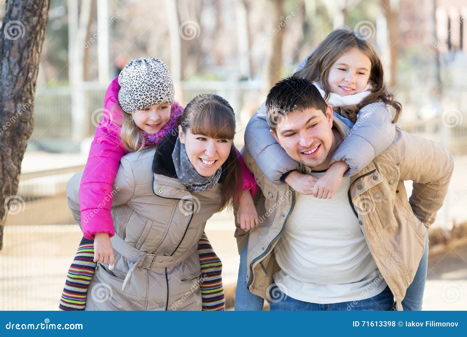 United Family of Four Posing and Laughing Stock Photo - Image of ...