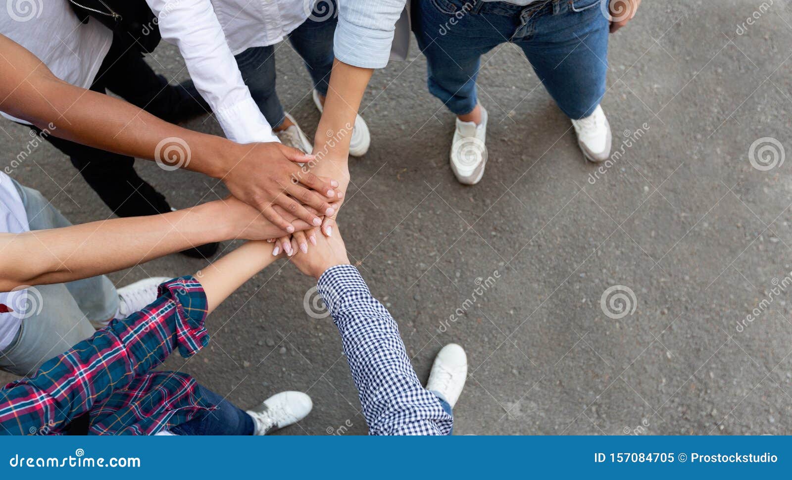 Multiracial Students Joining Hands Together in Cooperation Stock Image ...