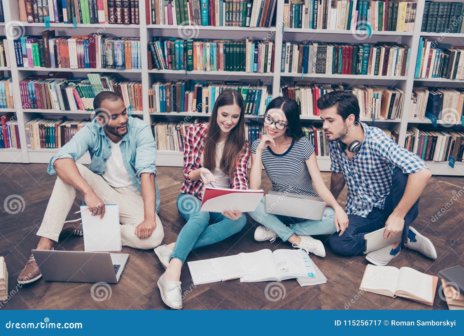Unity and Connection of People. Four Multi Ethnic Students Friends, Doing Research in Library ...