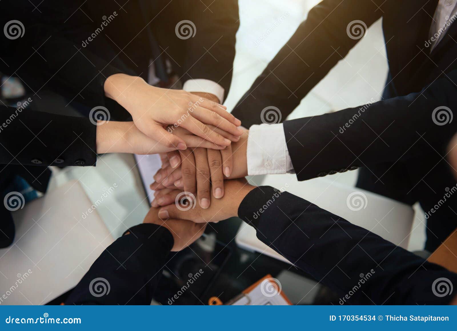 Close Up Top View of Young Business People Putting Their Hands Together ...
