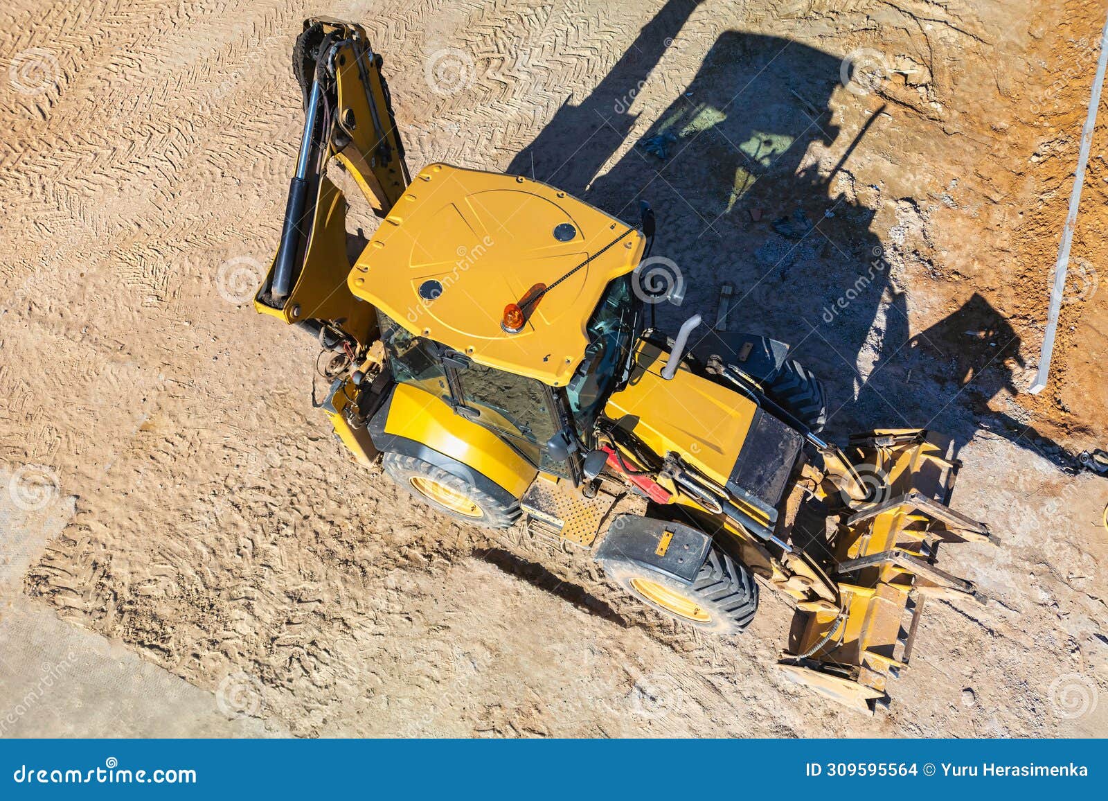 Universal Excavator or Loader with Folded Bucket at Construction Site ...