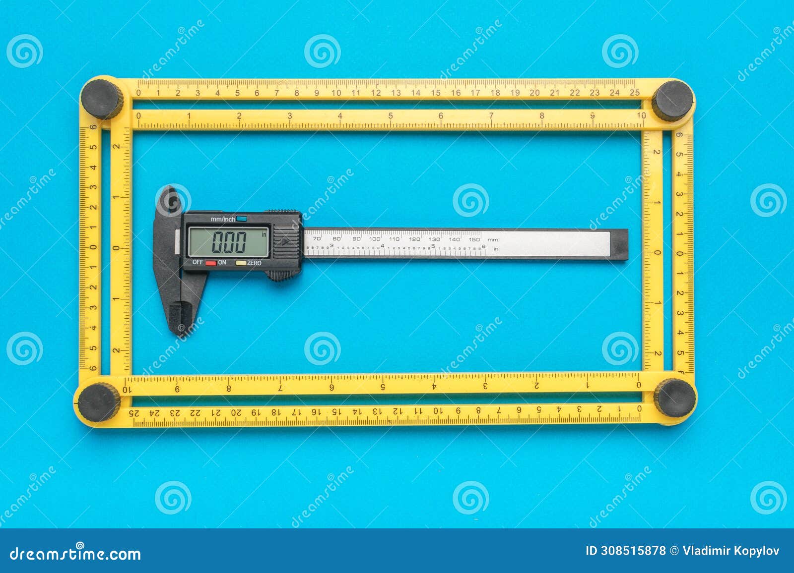 Universal Measuring Ruler and Electronic Vernier Caliper on a Blue ...