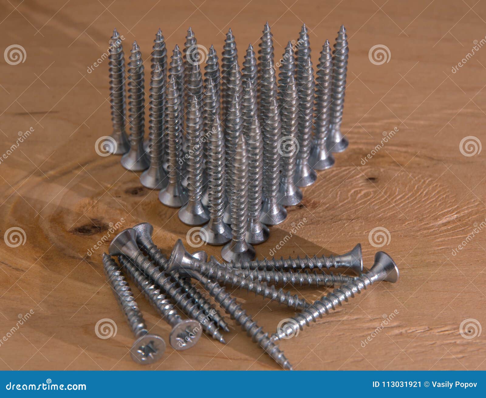 Universal Silver Screws with a Triangle Pointing Upwards Stock Image ...