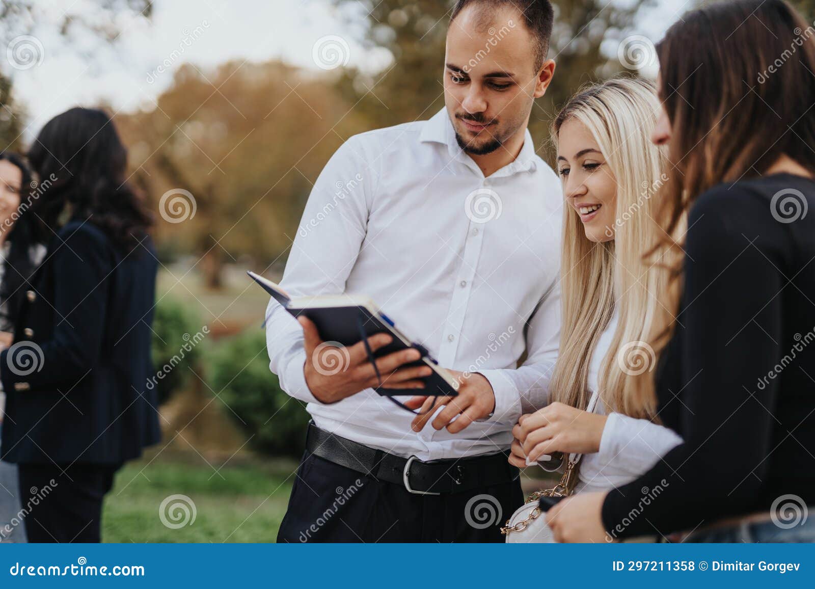 Students Collaborating on Academic Subjects in a Sunny Park Stock Photo ...