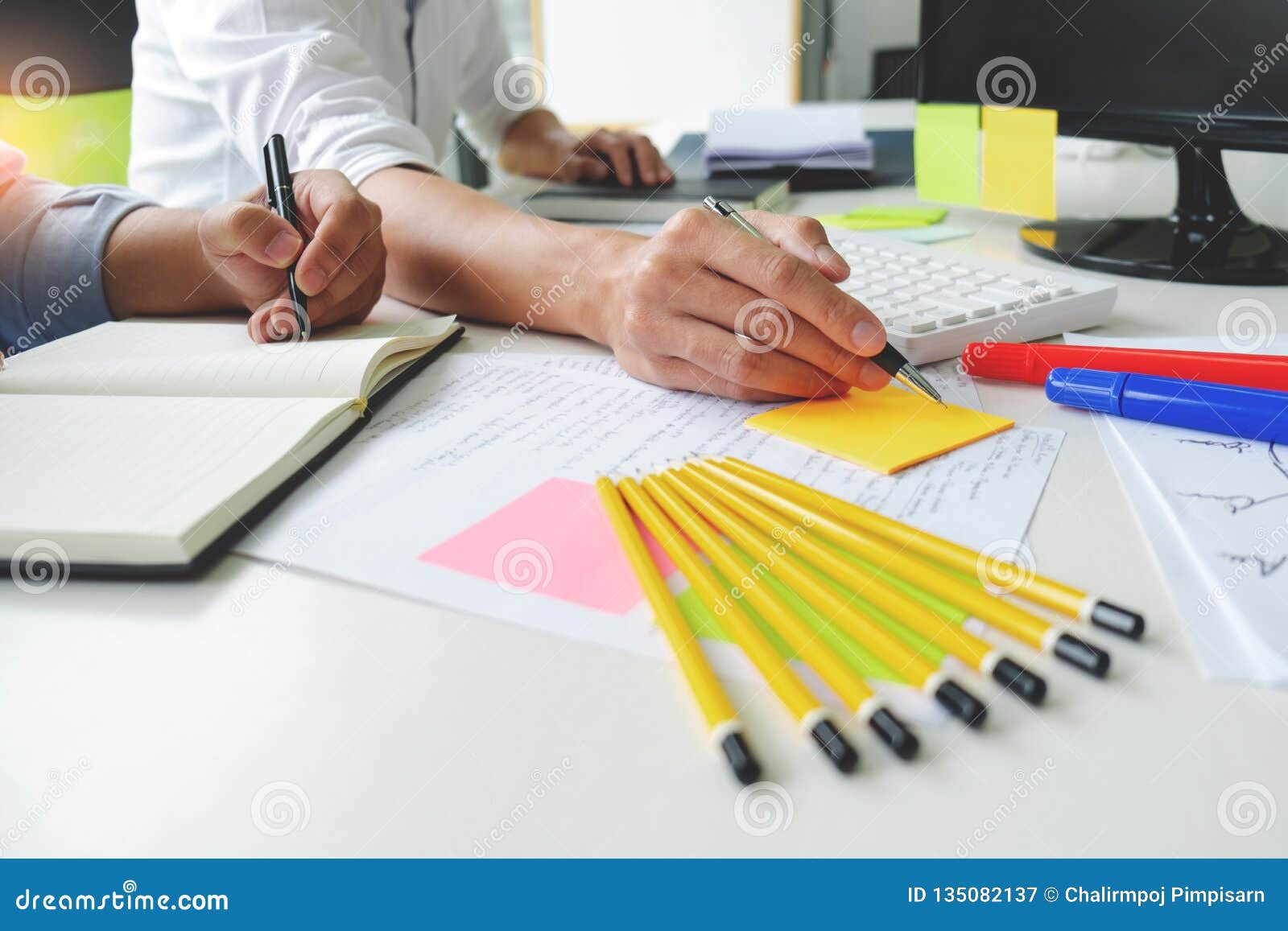 University / College Students Discussing on Homework in Classroom ...