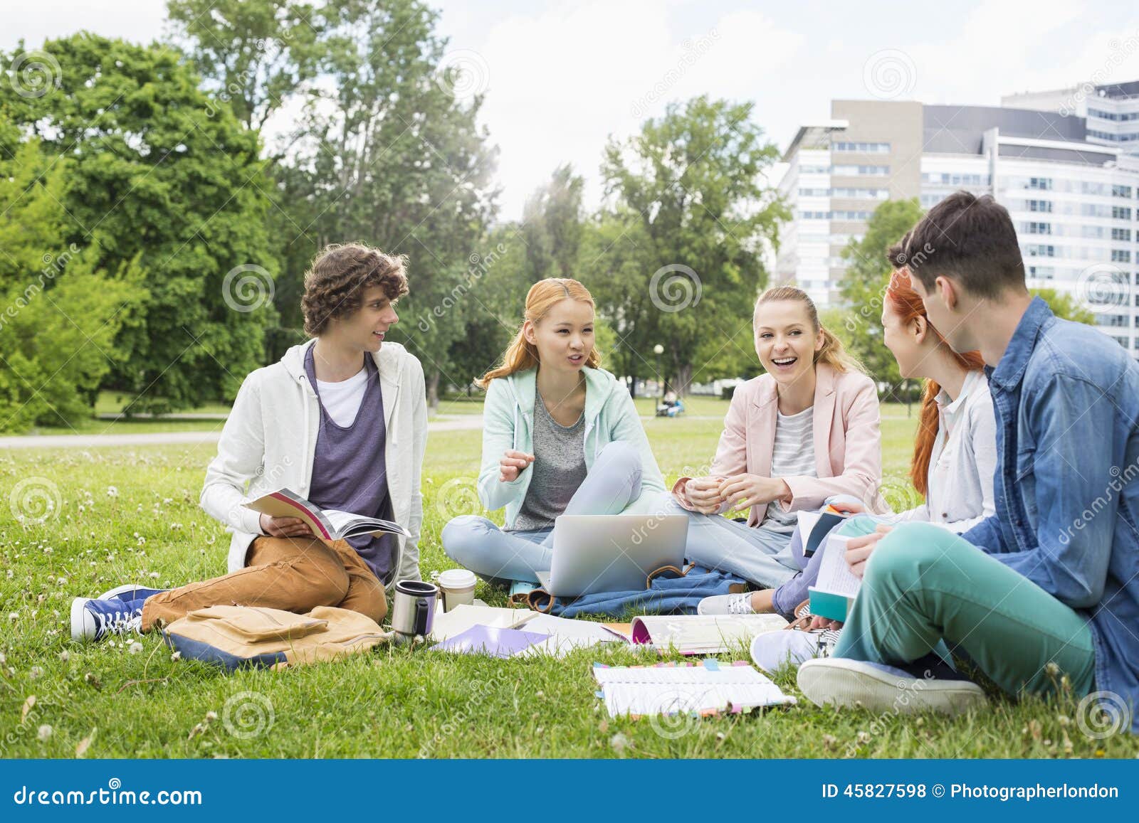 University Friends Studying Together on Grass Stock Photo - Image of ...