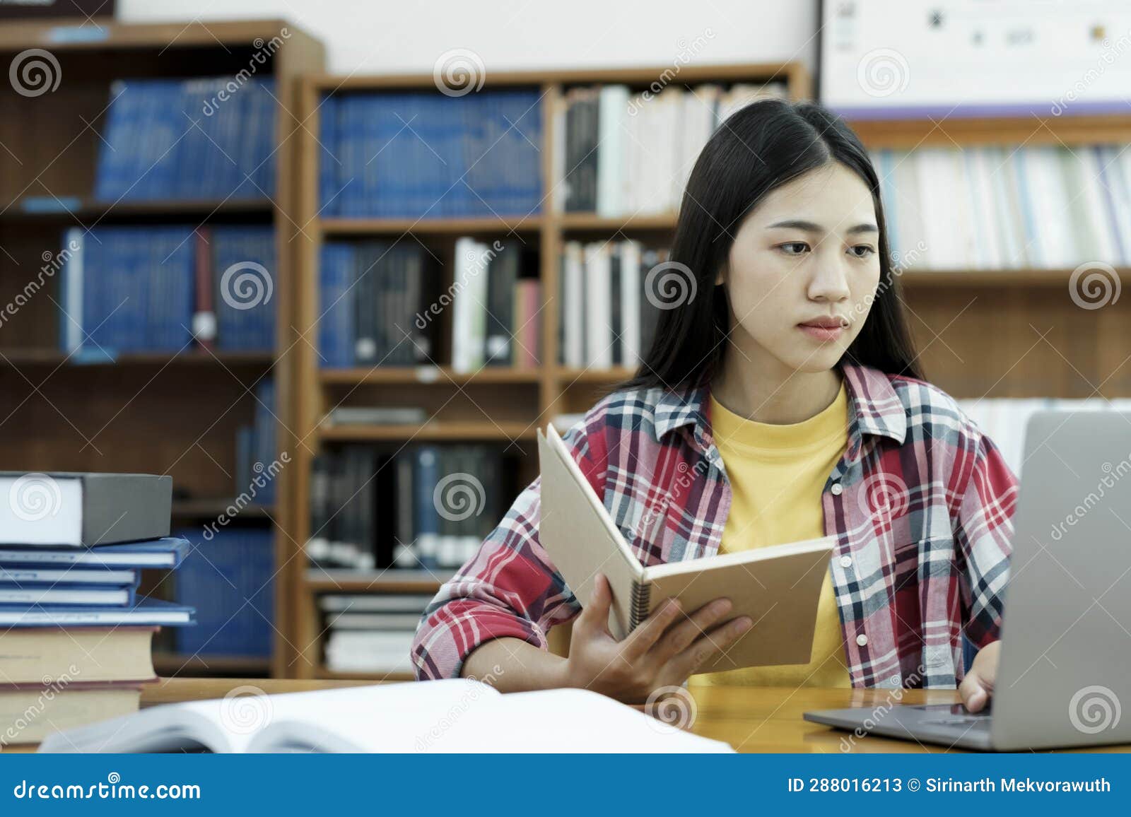 Young University Student Using Laptop for Online Learning, Searching ...