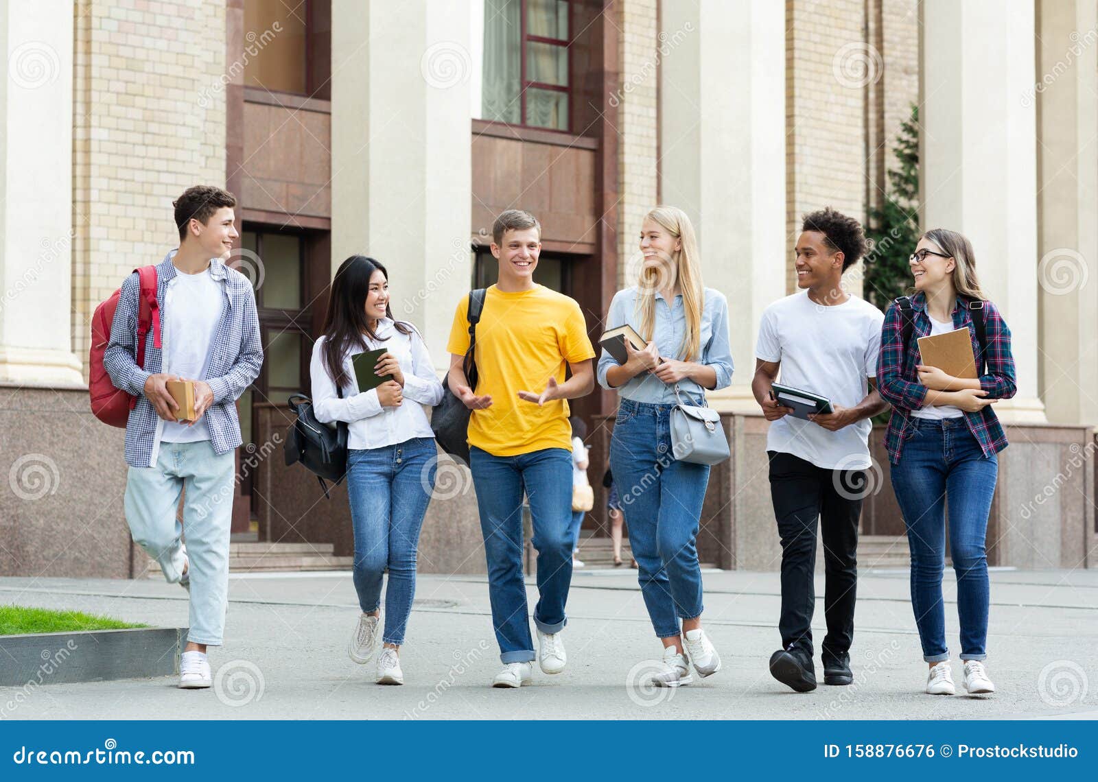 University Life. Classmates Walking Outside and Talking Stock Photo ...