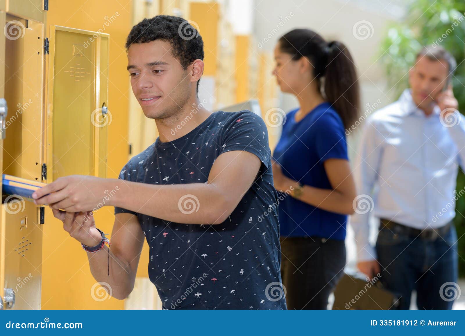 University Man Putting Things Inside Locker Stock Photo - Image of ...