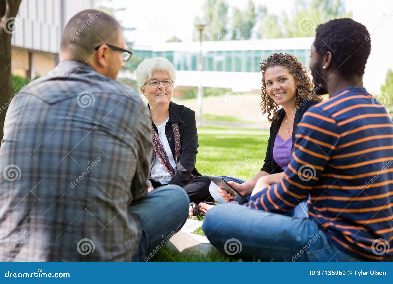 University Professor Helping Students Outdoors Stock Image - Image of ...