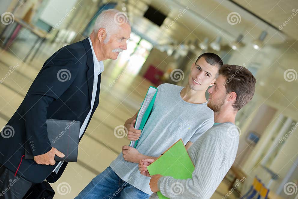 University Professor Talking with Students Stock Image - Image of ...