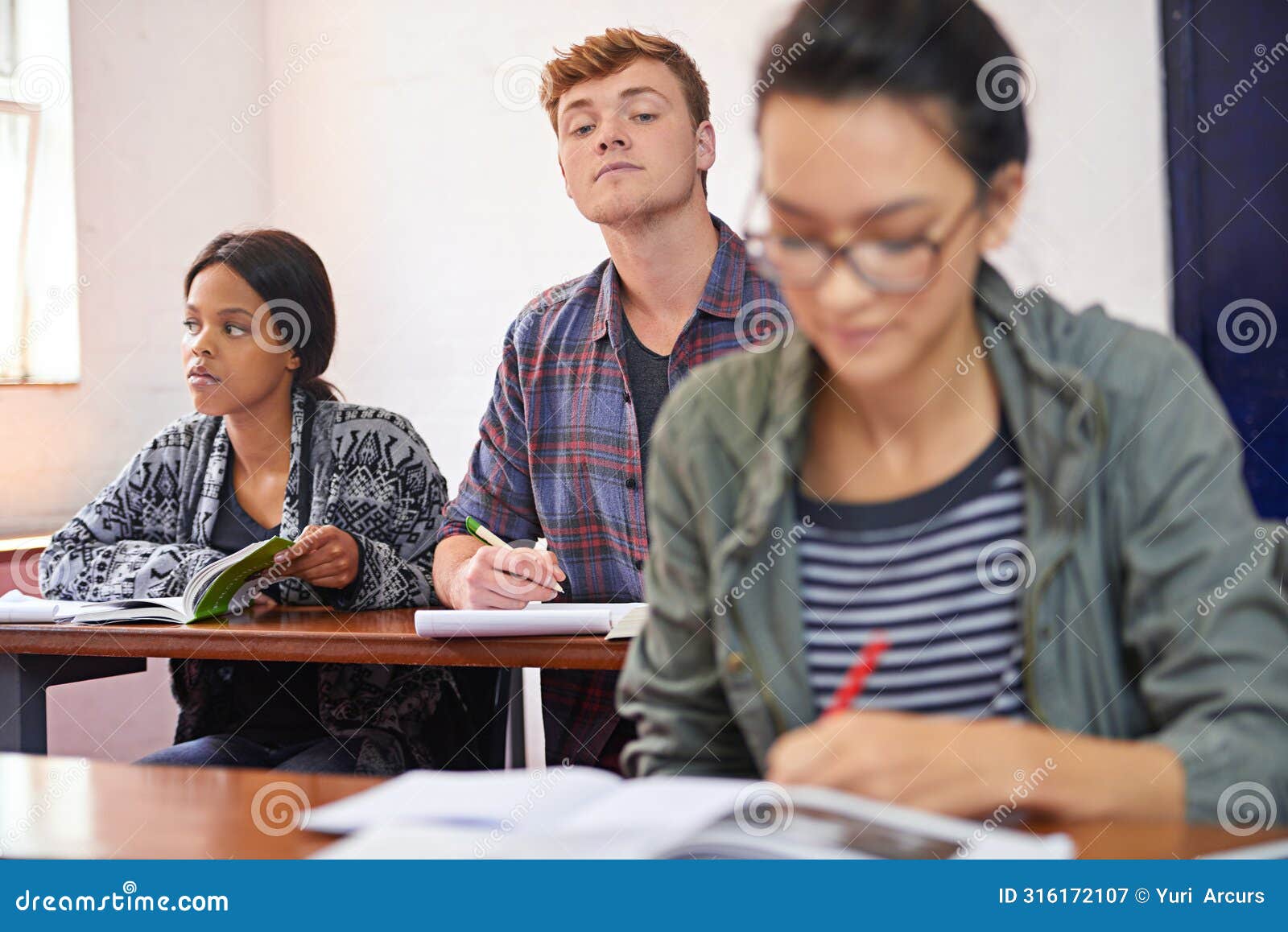 University Student, Man and Copying Test in Classroom with Reading ... University Student, Man and Copying Test in Classroom with Reading ...