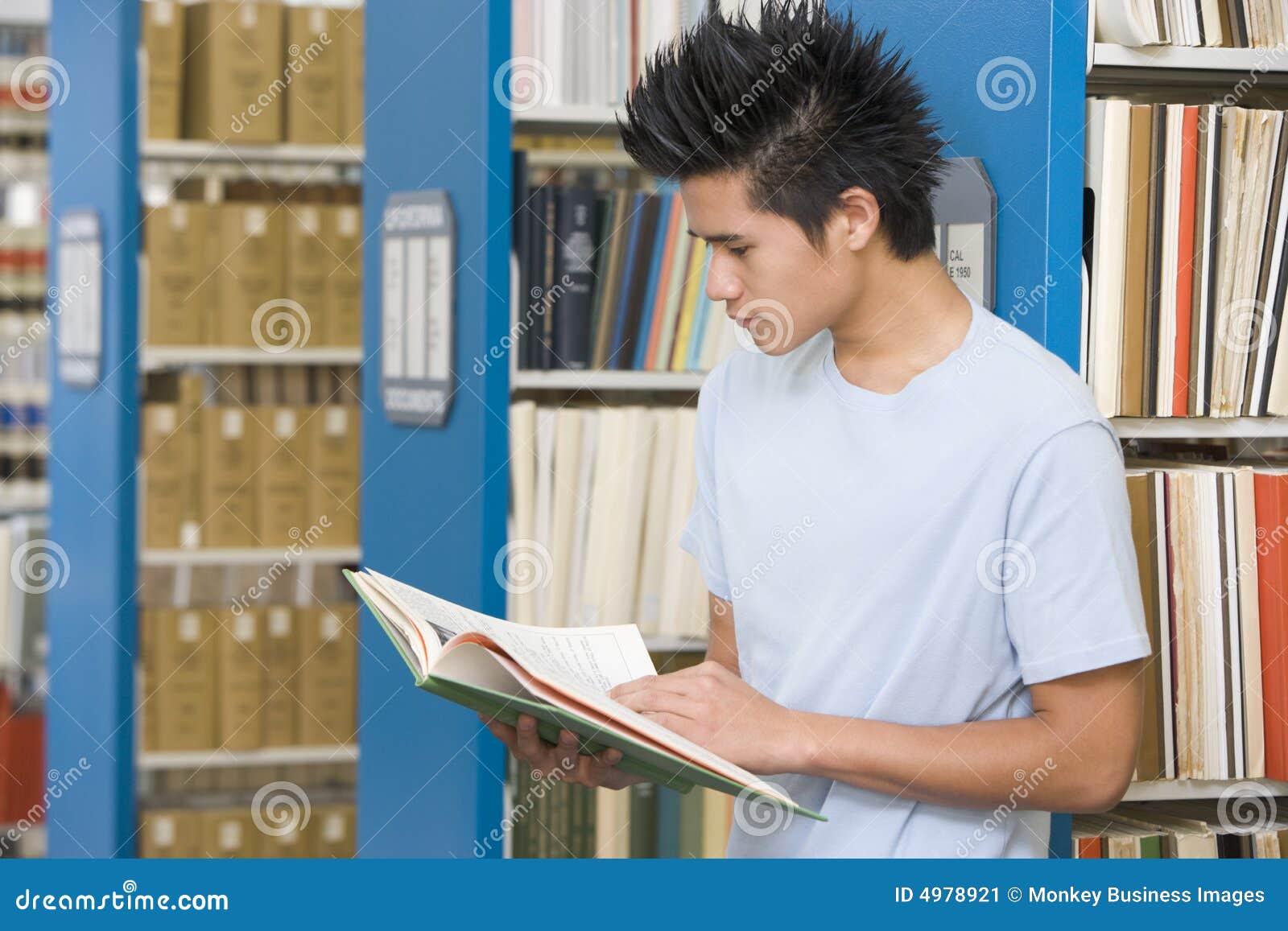 University Student Reading in Library Stock Image - Image of male ...