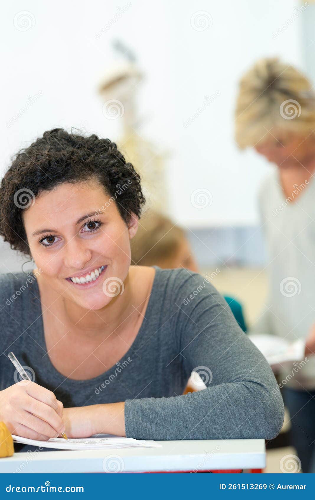 University Student Smiling Posing on Desk Stock Image - Image of desk ...