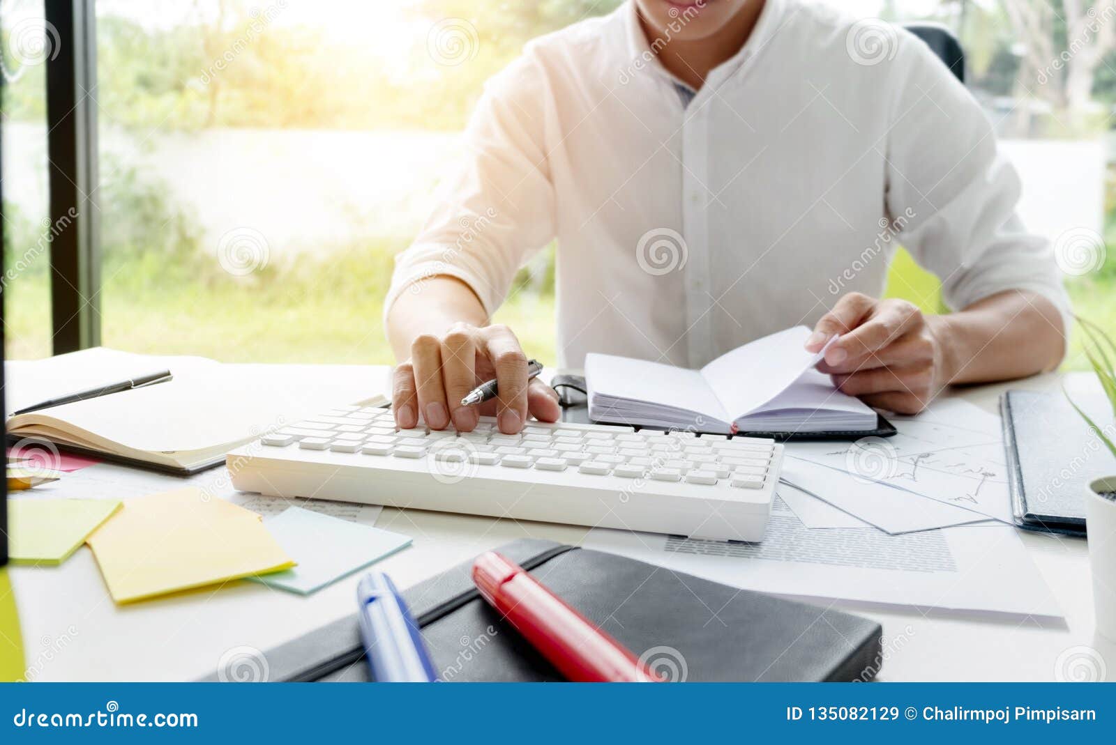University Student Working in Library with Homework after Study Class ...