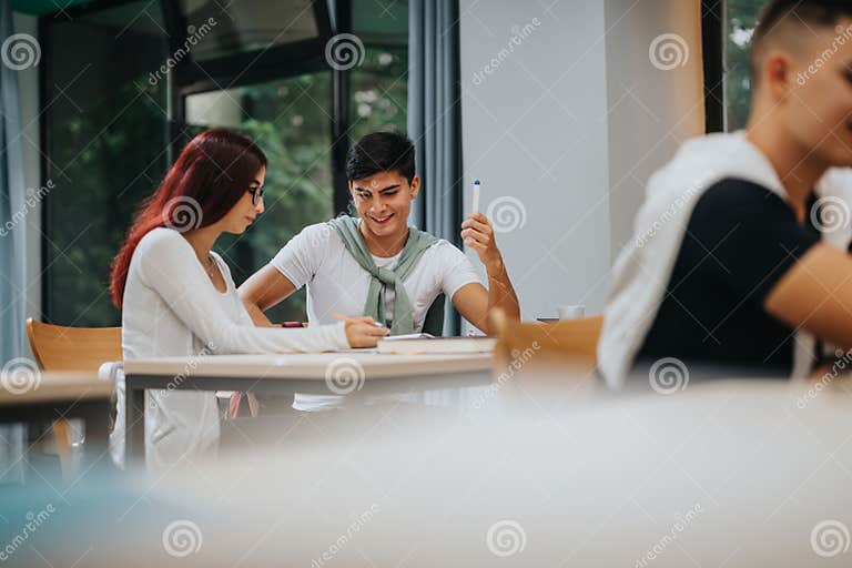 University Students Collaborating on a Group Project in Classroom ...