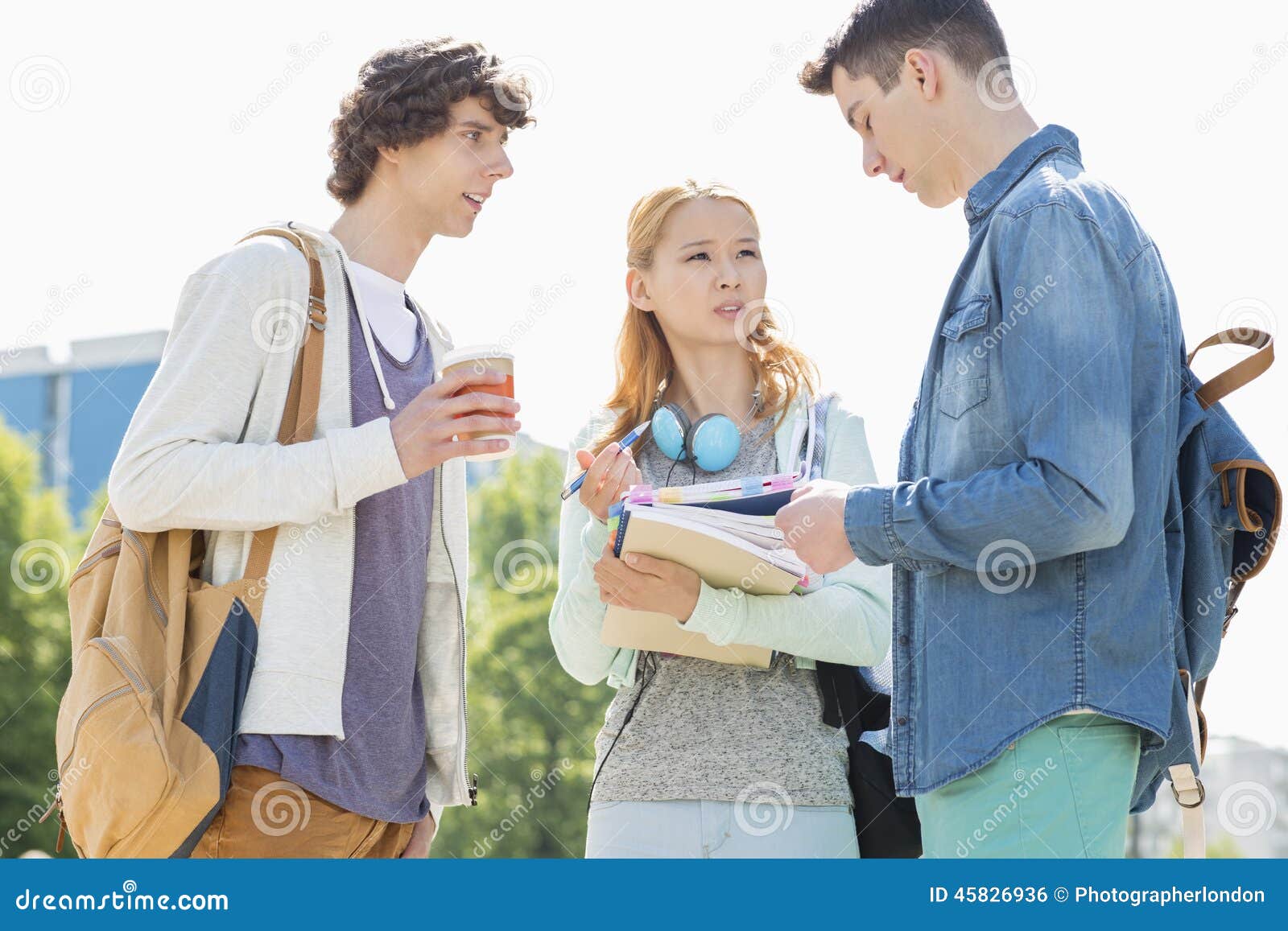 University Students Conversing at Campus Stock Photo - Image of ...