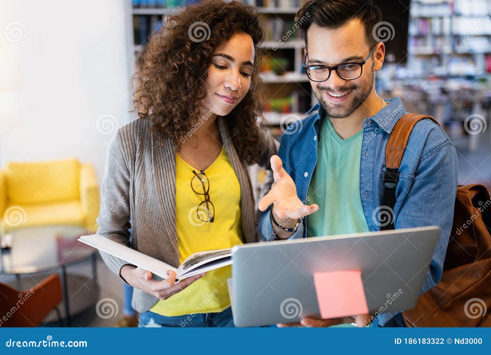 University Students in Cooperation at Library. Group of Young Friends ...