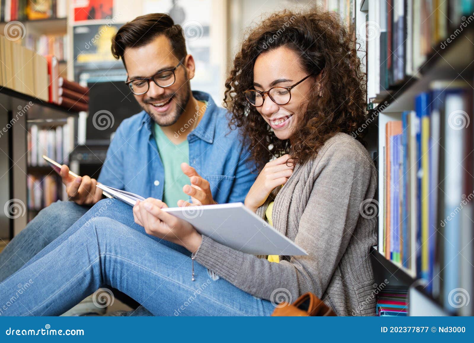 University Students in Cooperation at Library. Group of Young Friends ...